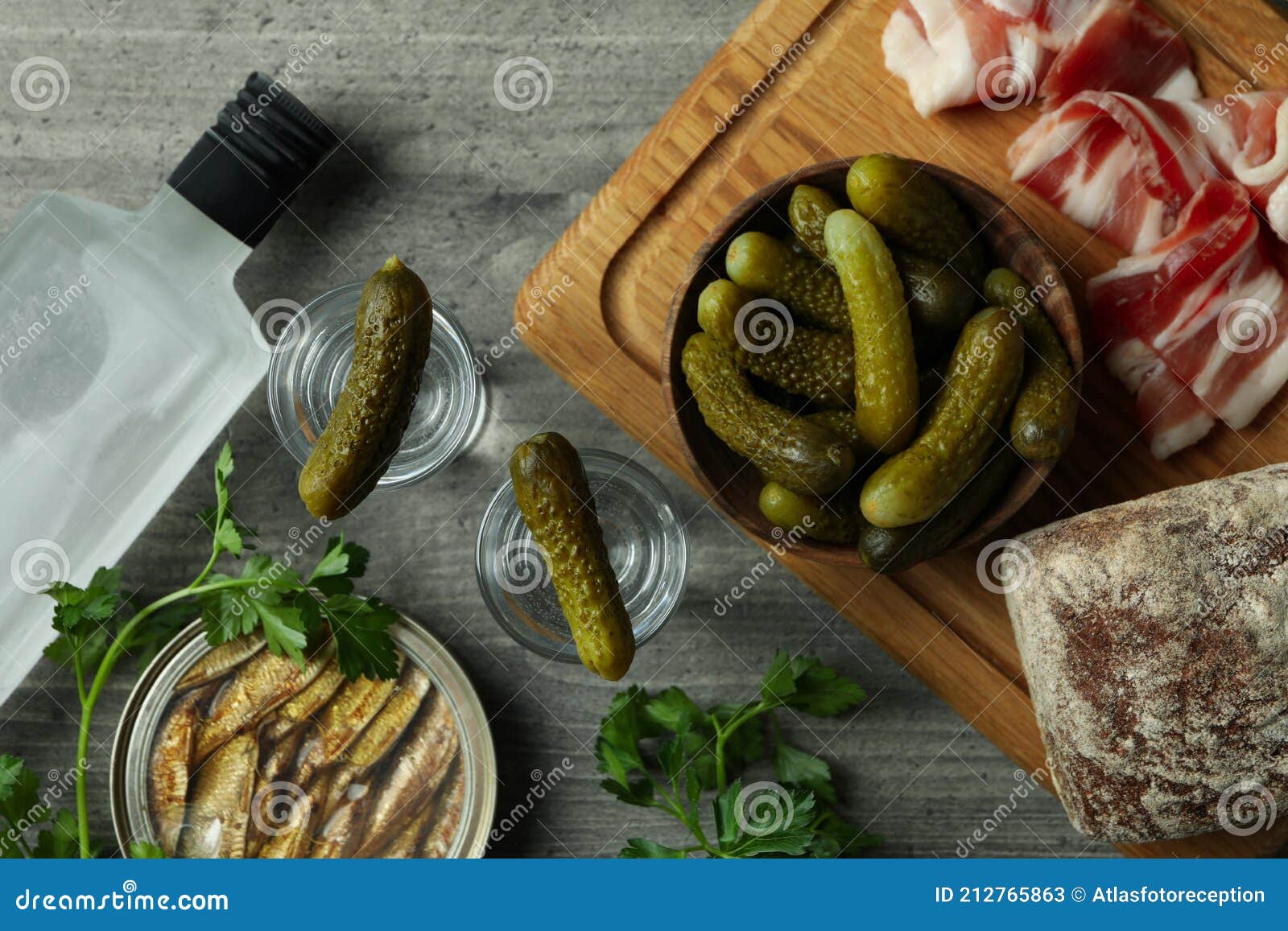 Bottle and Shots of Vodka, and Different Snacks on Gray Background ...