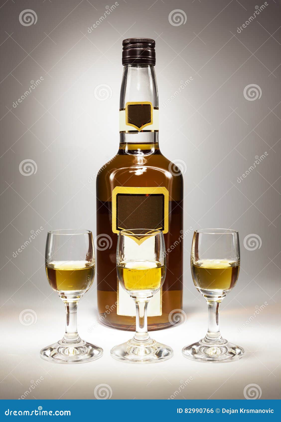 Bottle and Three Glasses of Spirit Drink Stock Photo - Image of ...