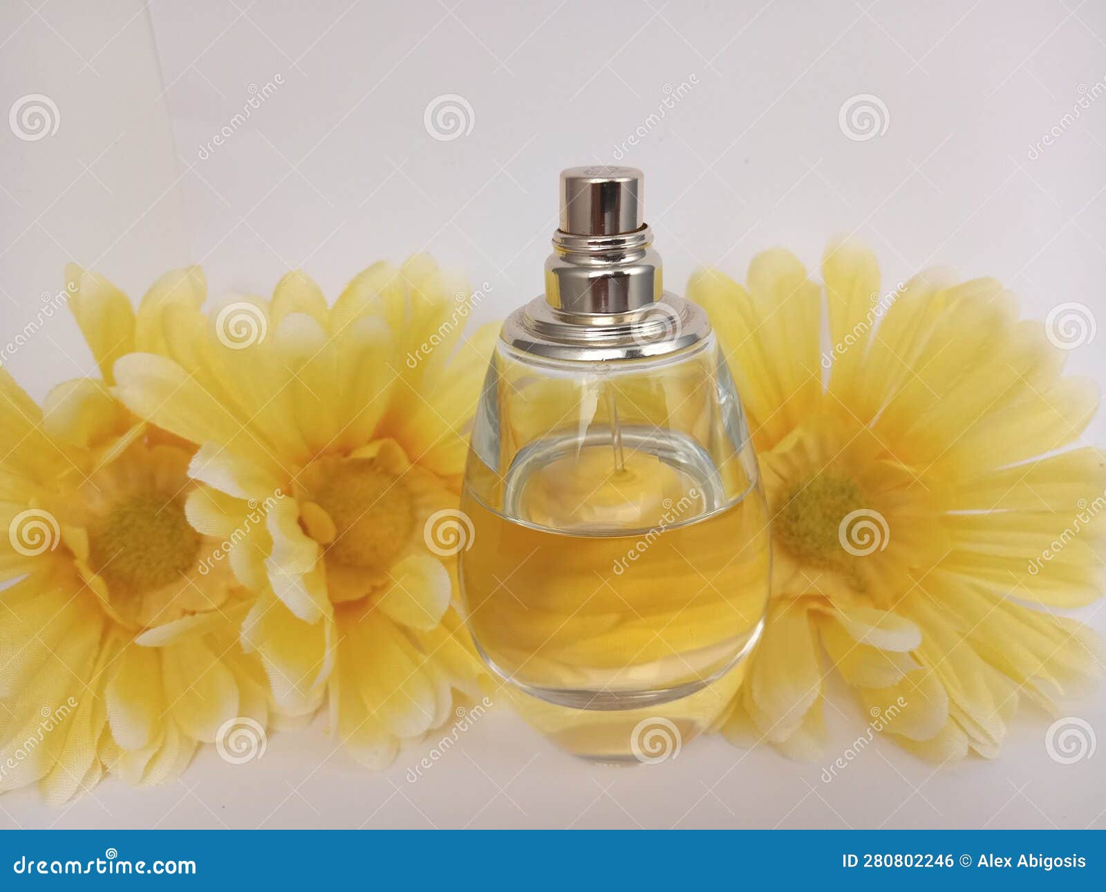A Bottle of Unisex Perfume with Yellow Daisies on a White Background ...