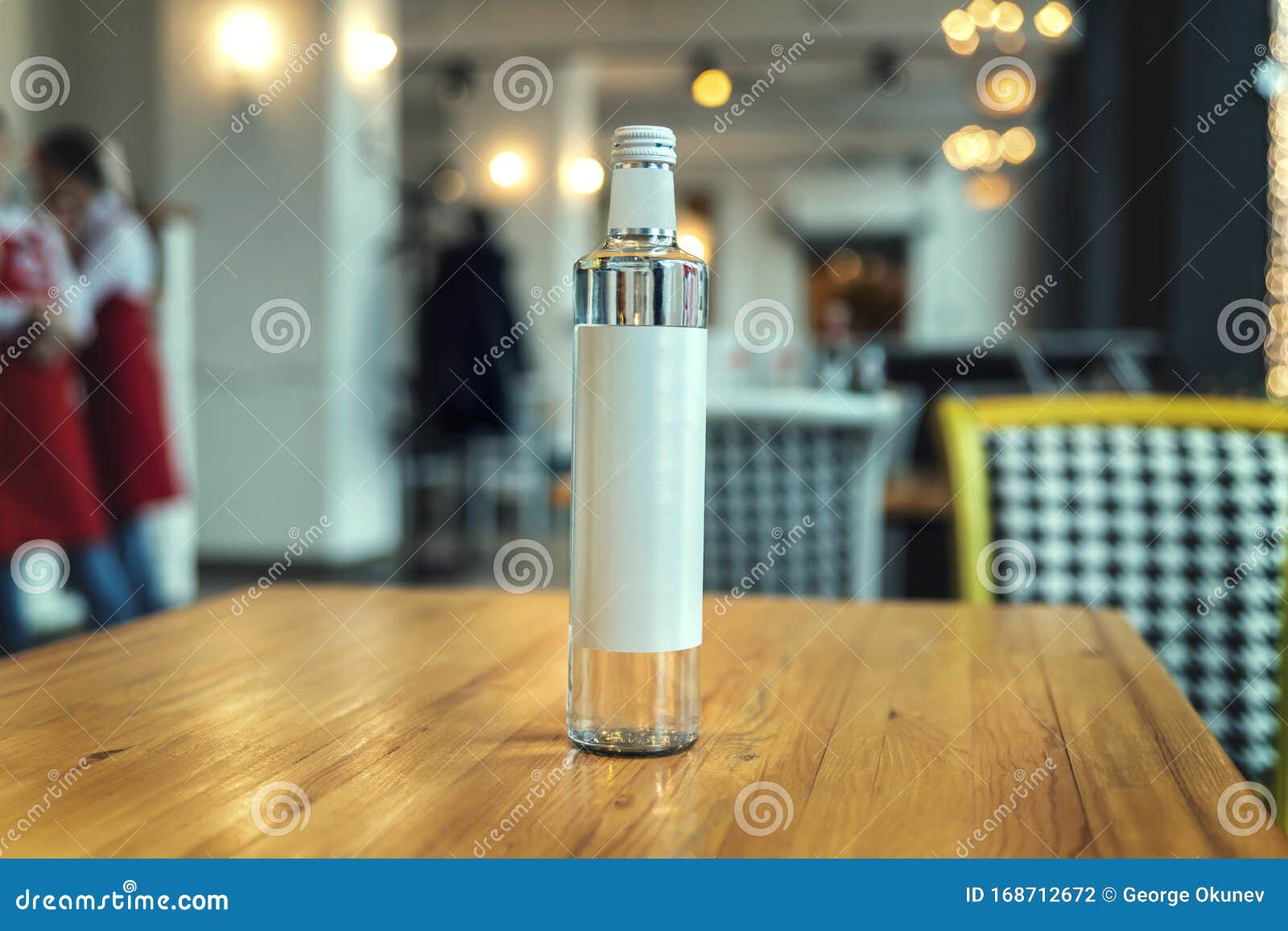A Bottle of Water with an Empty Label in a Restaurant Stock Photo ...