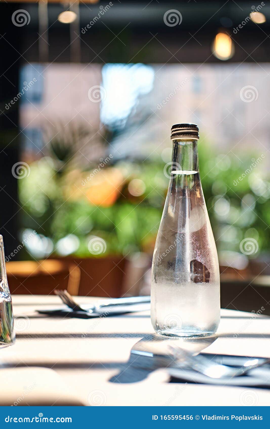 Bottle of Water on the Table Stock Photo - Image of aqua, fluid: 165595456