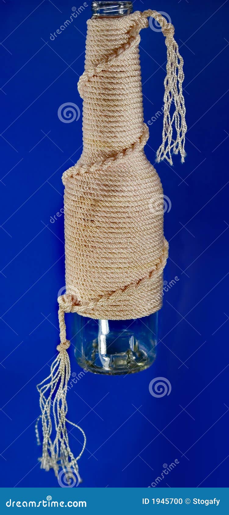 Bottle wrapped in rope stock photo. Image of strands, covering - 1945700