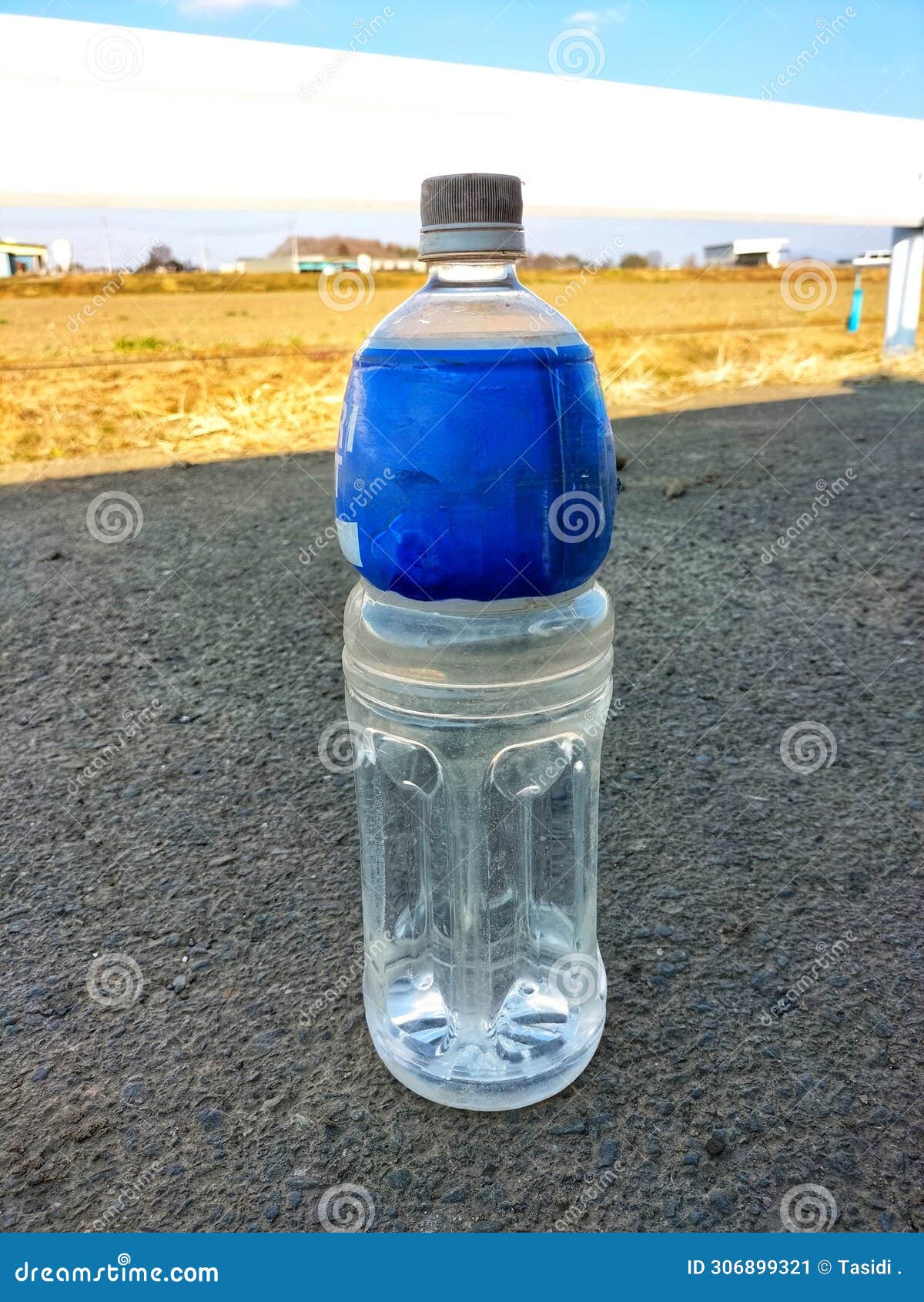 Bottled Drinking Water on the Asphalt Road Stock Image - Image of road ...