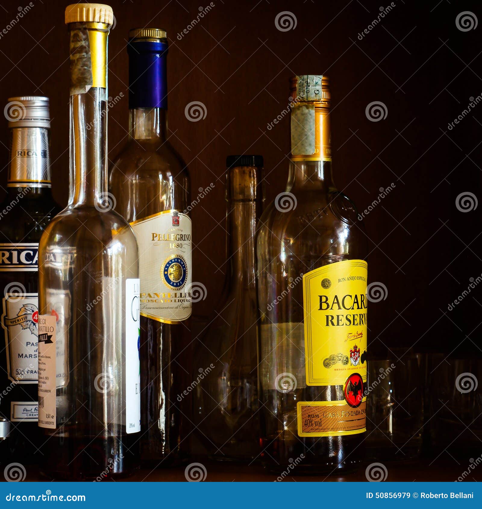 Bottles of Alcohol in a Glass Case Editorial Stock Image - Image of ...