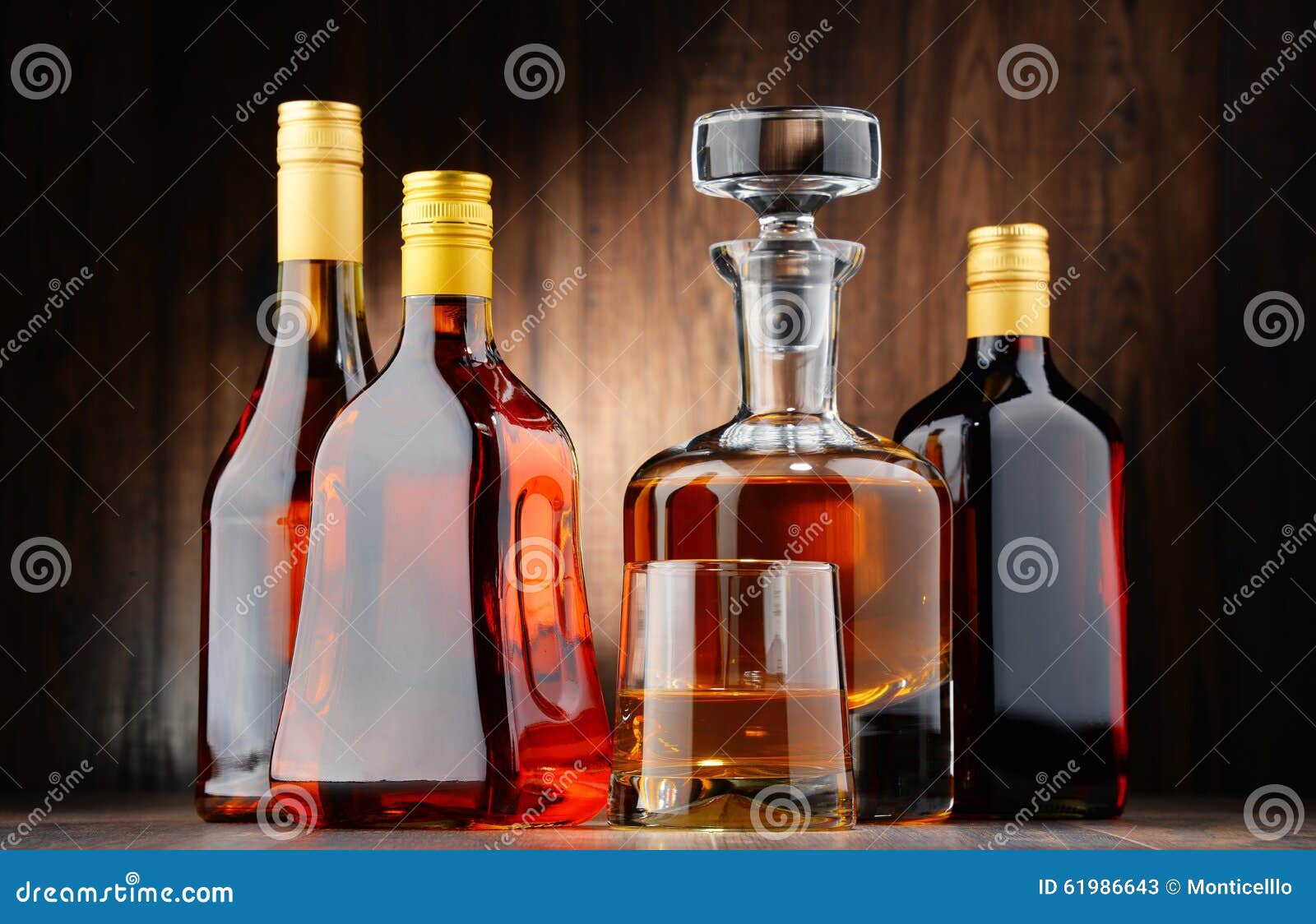 Bottles of Assorted Alcoholic Beverages and Glass of Whisky Stock Image ...