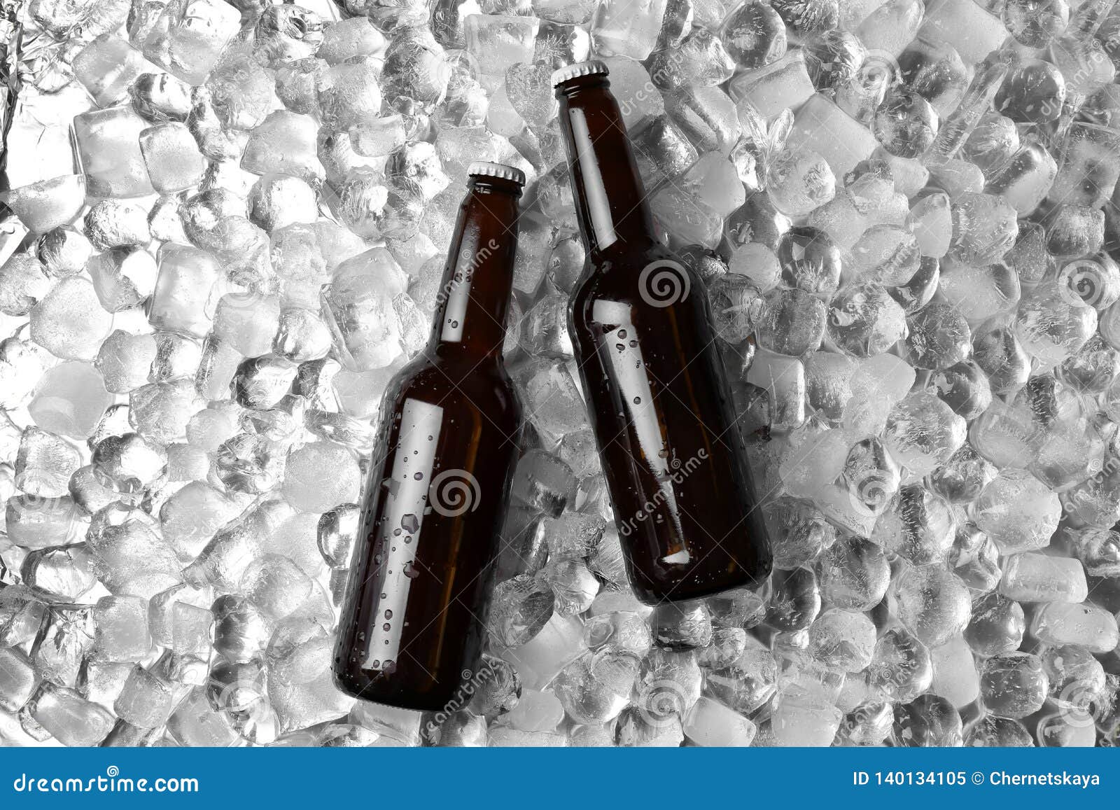 Bottles of Beer on Ice Cubes Stock Image - Image of iced, cool: 140134105