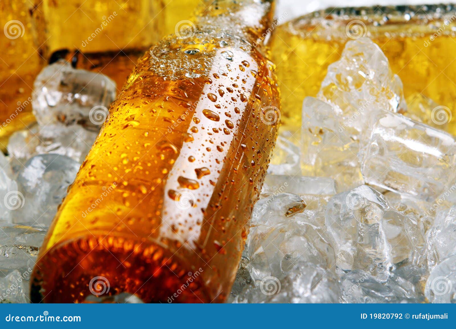 Bottles of Beer Lying in the Ice Stock Photo - Image of drop, icecube ...