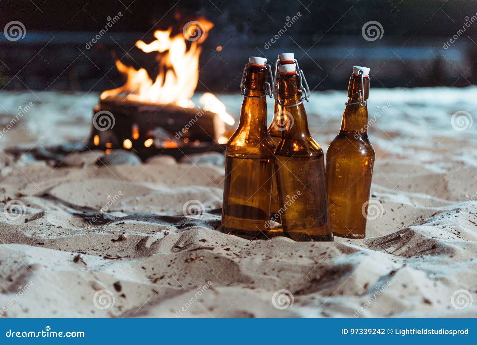 Bottles of Beer Standing on Sandy Beach with Bonfire Stock Photo ...