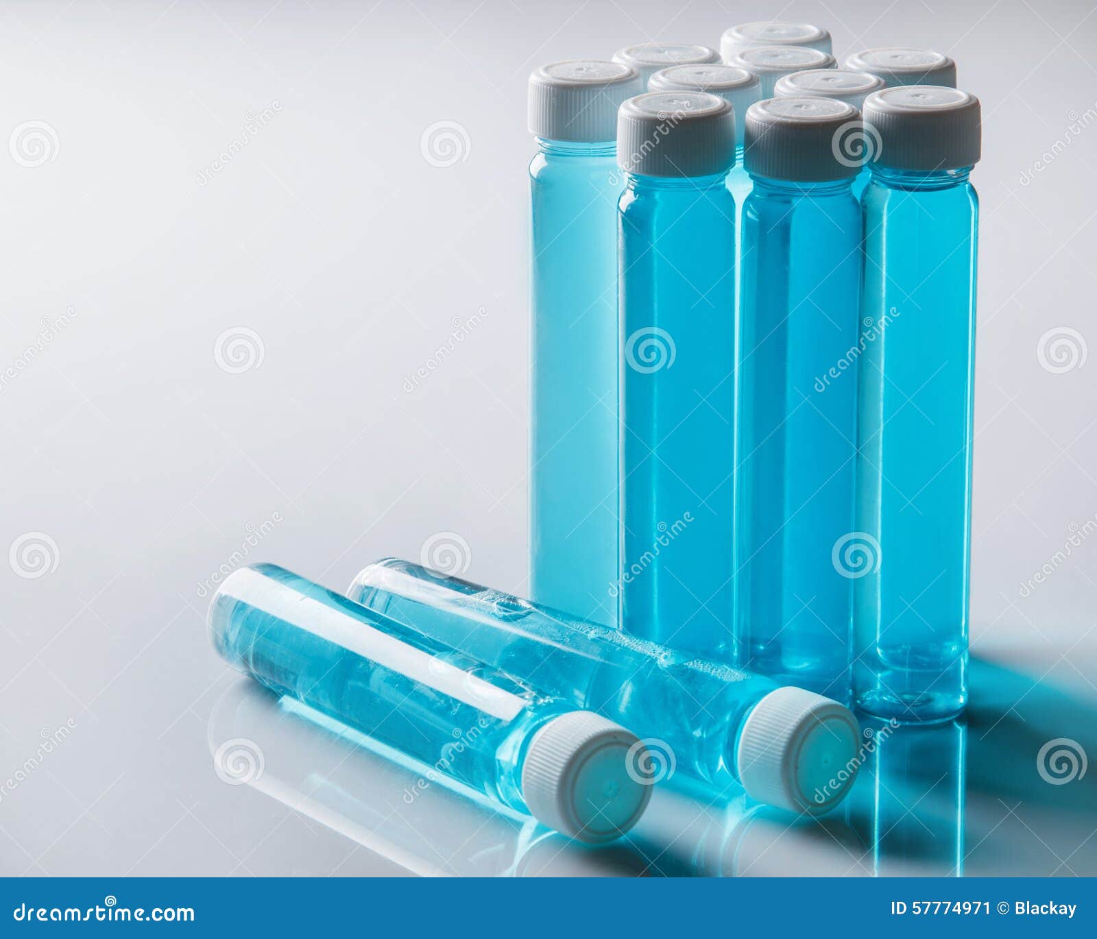 Bottles with blue liquid stock image. Image of analyzes - 57774971