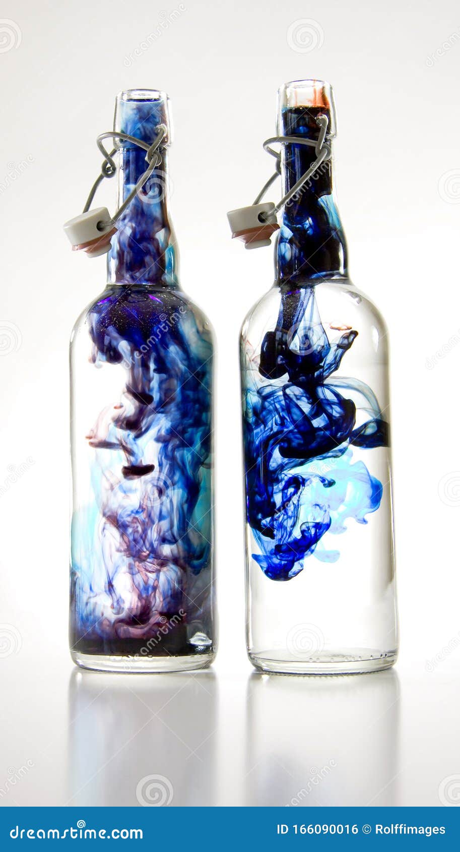 Bottles with blue smoke stock photo. Image of purity - 166090016