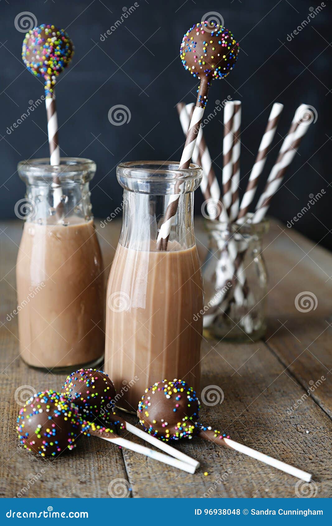 Bottles of Chocolate Milk with Straws and Cake Pops Stock Photo - Image ...