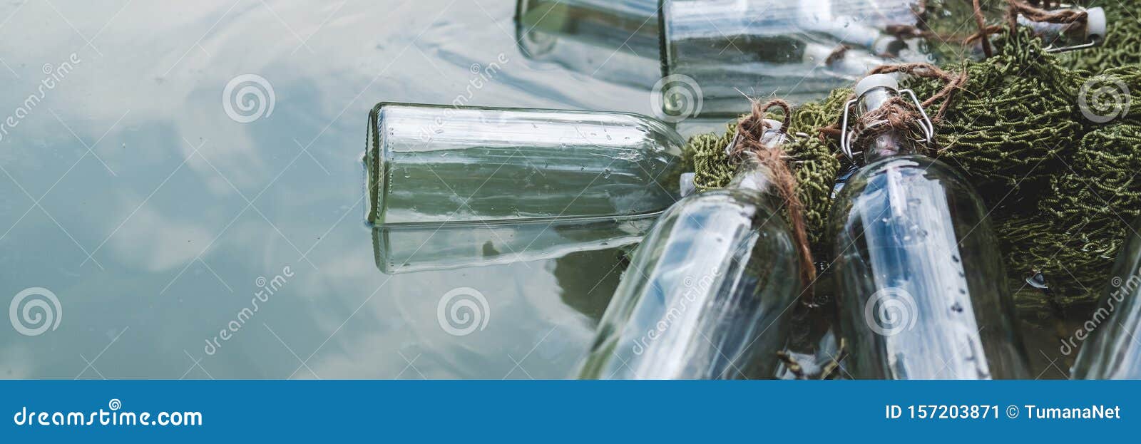 Bottles Connected with Notes Inside Float by the Lake. Quests, Games ...
