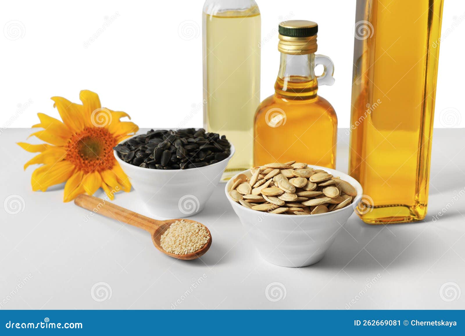 Bottles of Different Cooking Oils, Sunflower and Seeds on White ...