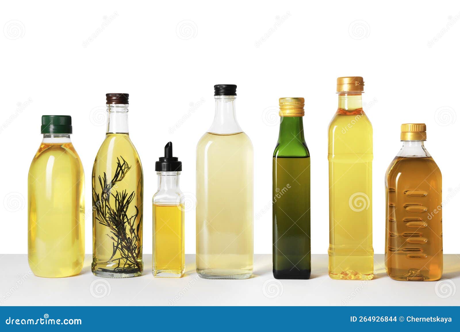 Bottles of Different Cooking Oils on White Background Stock Photo ...
