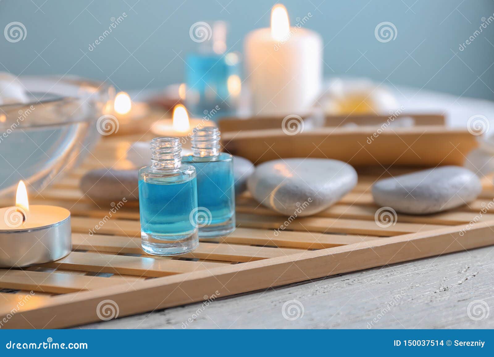 Bottles of Essential Oil for Spa Procedures on Table Stock Photo ...