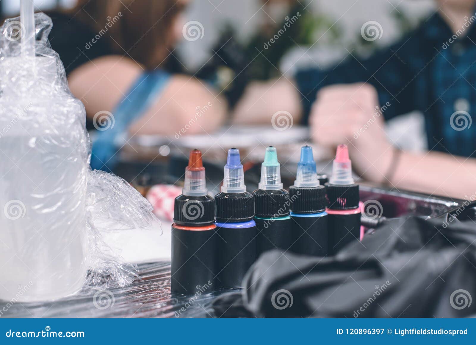 Bottles of Ink on Table in Front of Working Stock Image - Image of ...