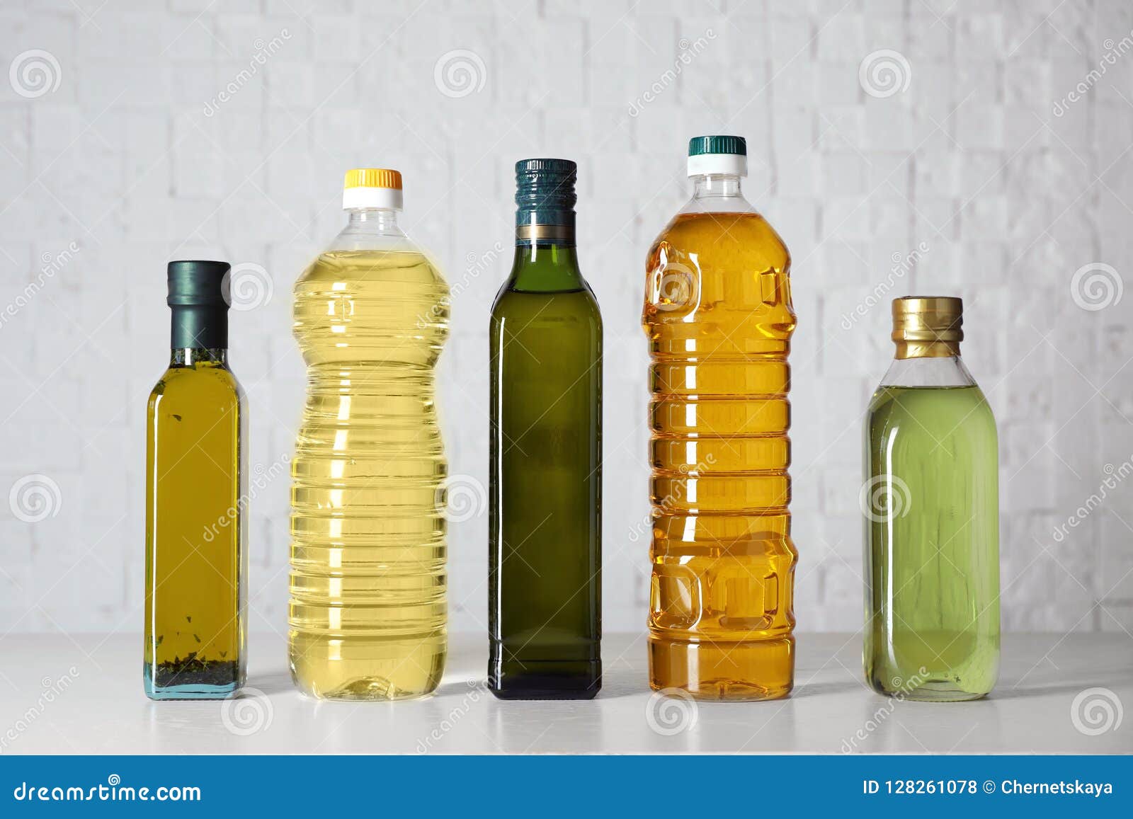 Bottles of oils on table stock photo. Image of gourmet - 128261078