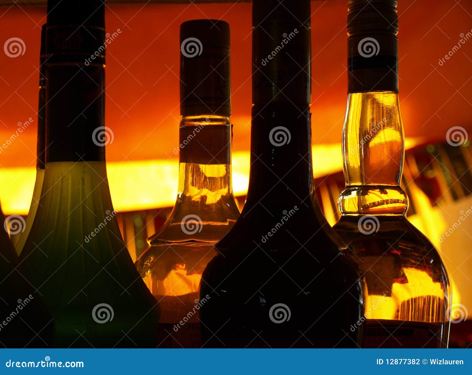 Bottles in an Orange Backlight Stock Photo - Image of stand, decoration ...