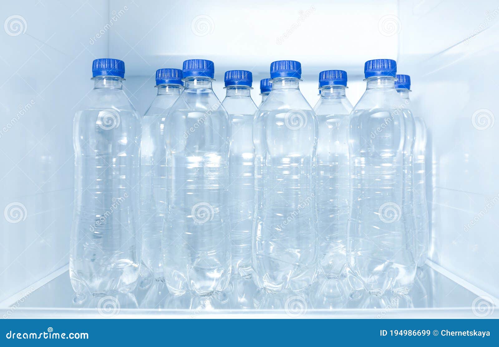 Bottles of Water on Shelf Inside Refrigerator Stock Image - Image of ...