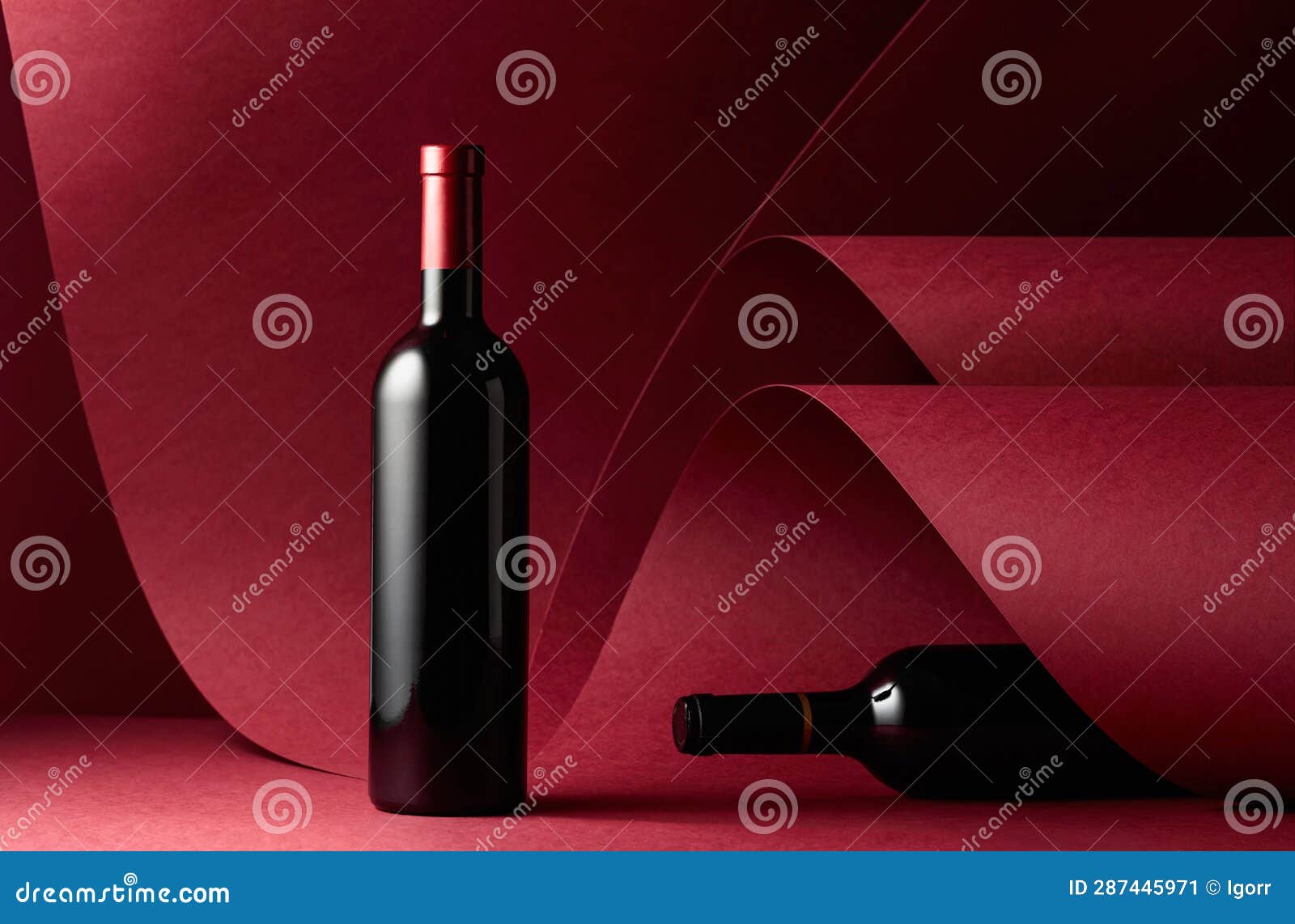 Bottles of Red Wine on a Red Background Stock Image - Image of ...