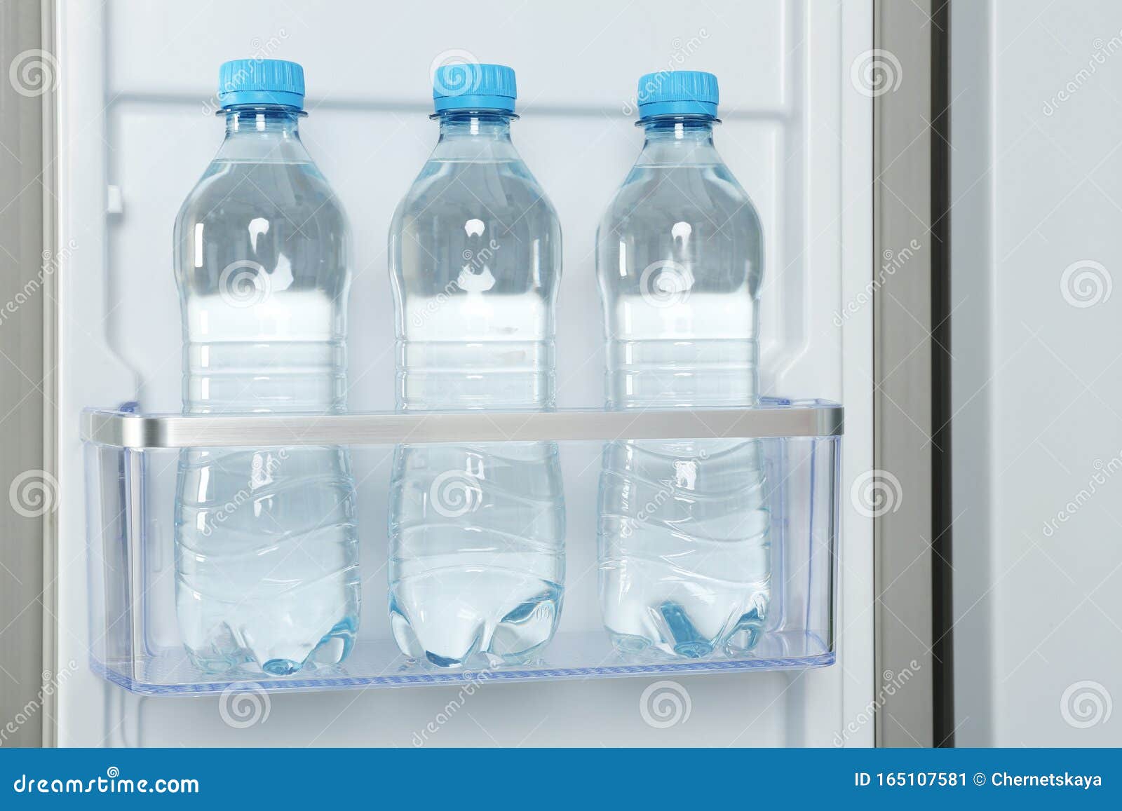 Bottles of water on shelf stock image. Image of domestic - 165107581