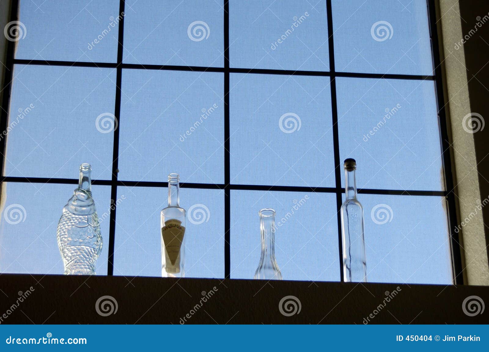 Bottles in a window 2 stock photo. Image of contemporary - 450404