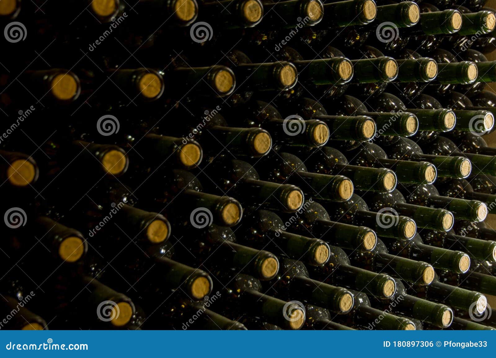 Bottles of Wine Arranged in Rows in a Wine Cellar Stock Photo - Image ...