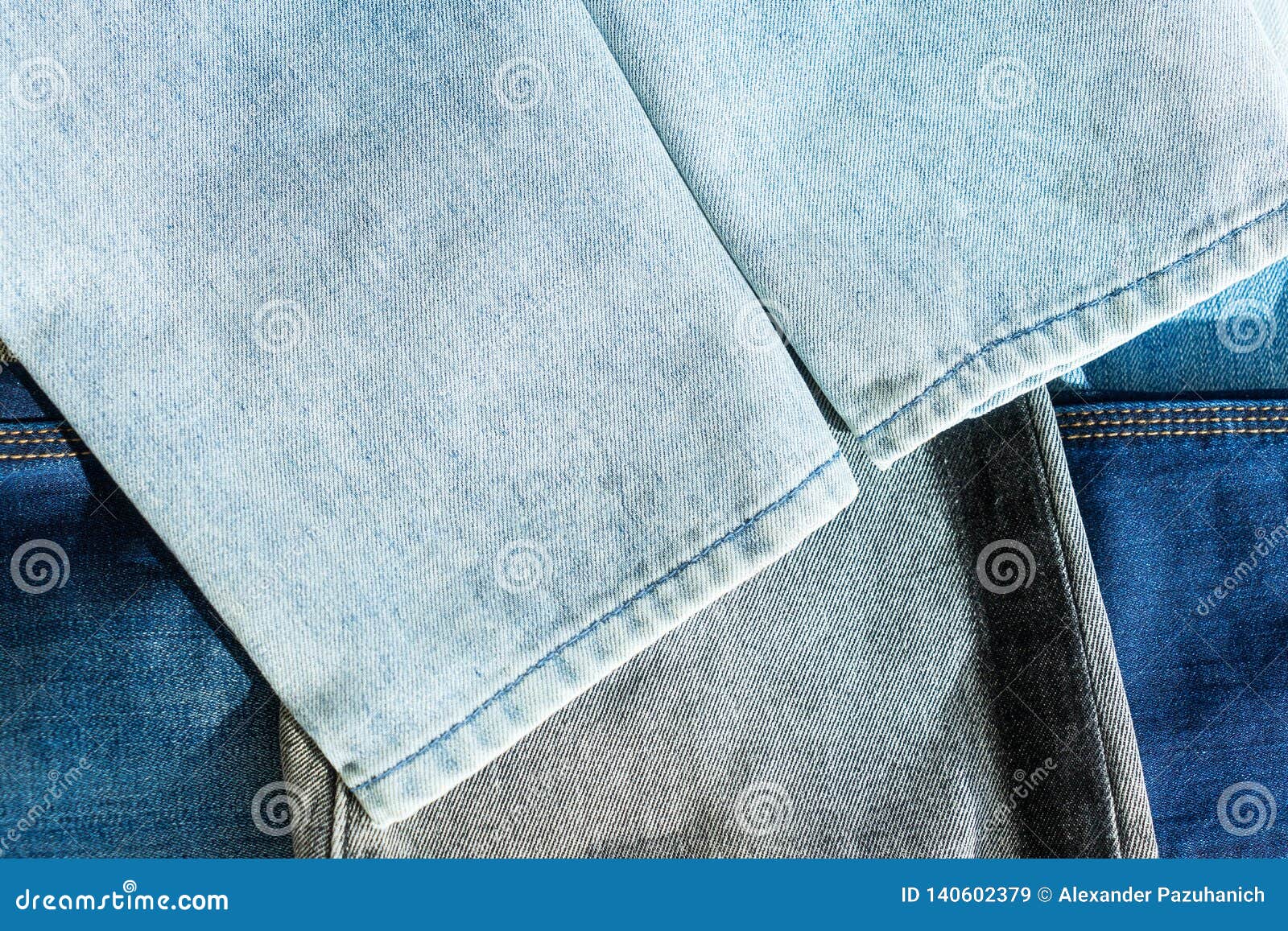 Bottom of Light Blue Jeans Lying. Stack of Different Pants. Stock Image ...