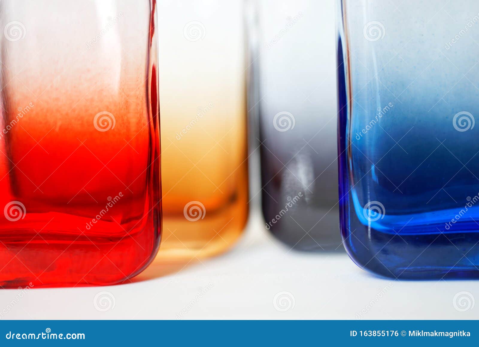 The Bottom of Transparent Multi-colored Bottles for Perfume or Liquids ...