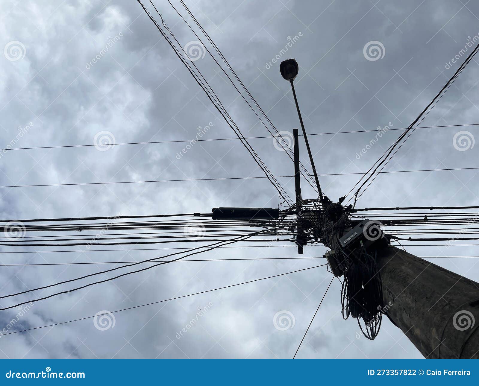 Point Of View Of A Pole Full Of Wires On A Gray Cloudy Sky Day ...