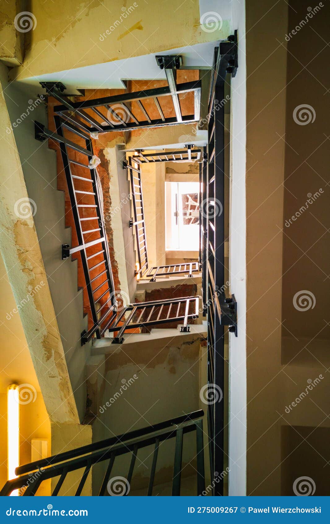 Bottom Up View of Bright Rectangular Spiral Staircase Stock Image ...