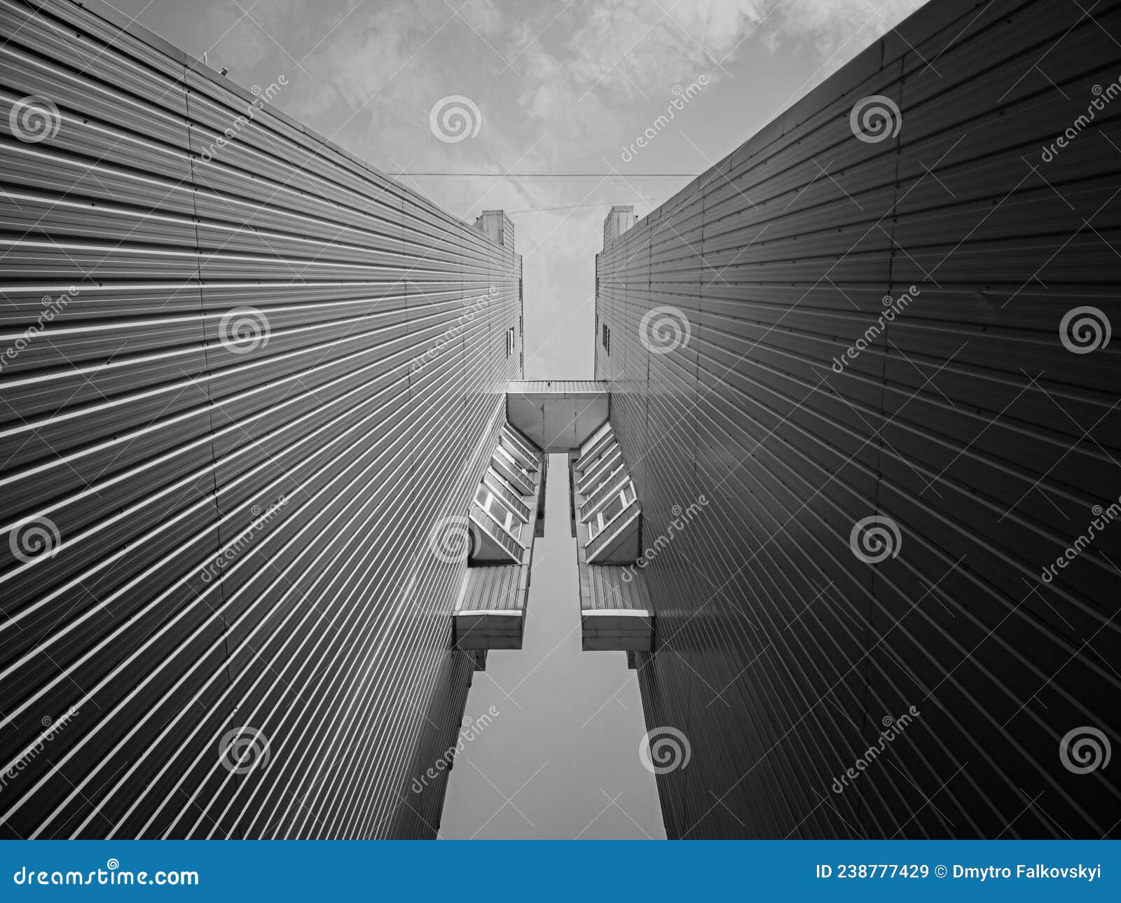 Bottom-up View of the Two Walls of a Modernist Building Connected by a ...