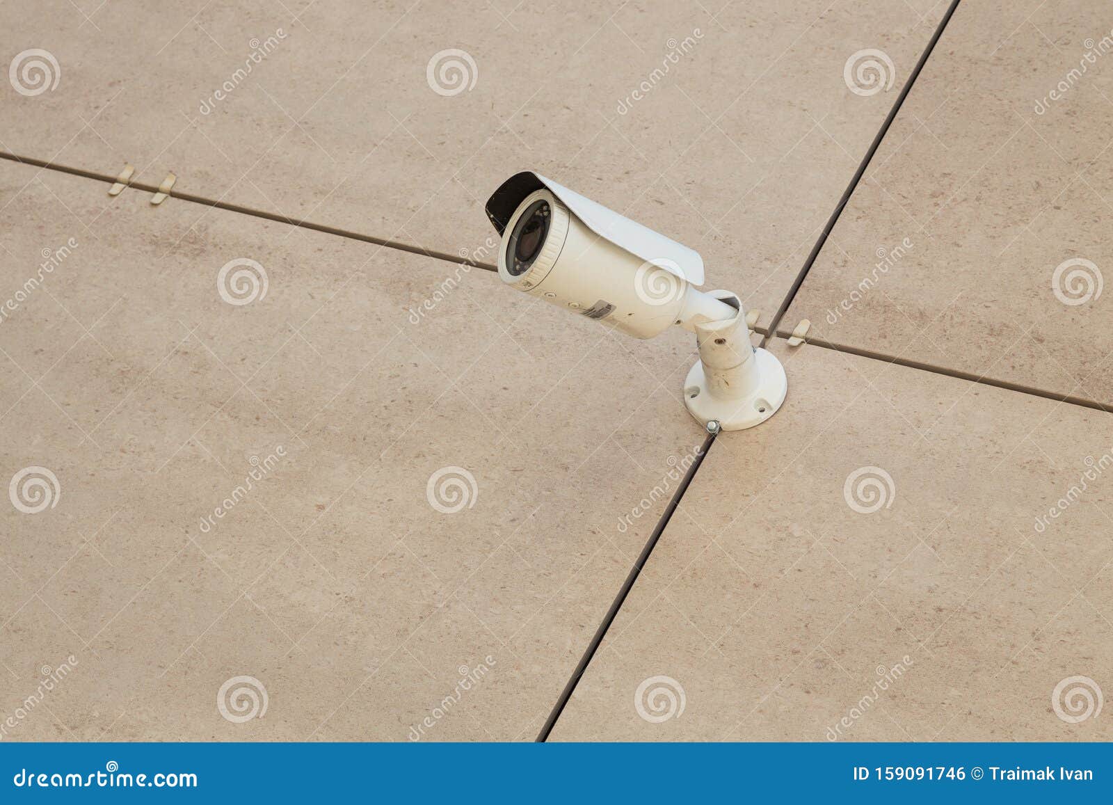 Bottom View of Beige Tiled Wall with White Safety Camera on it Stock ...