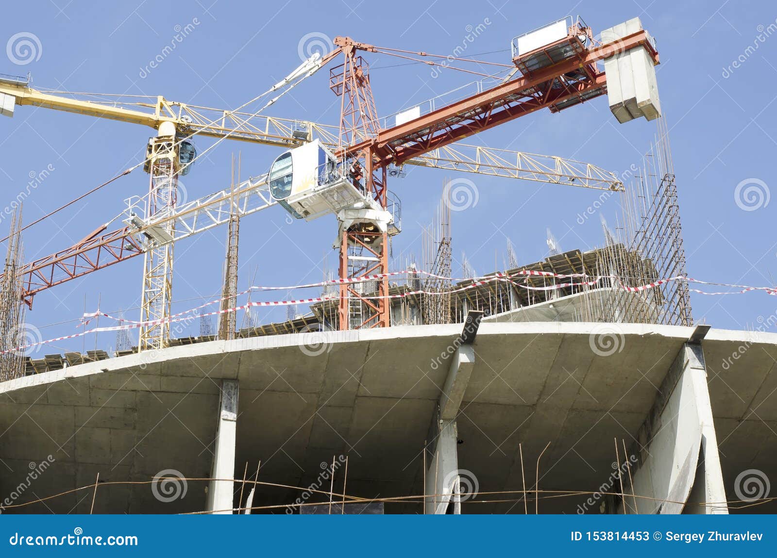 Bottom View of the Building Under Construction and Construction Cranes ...