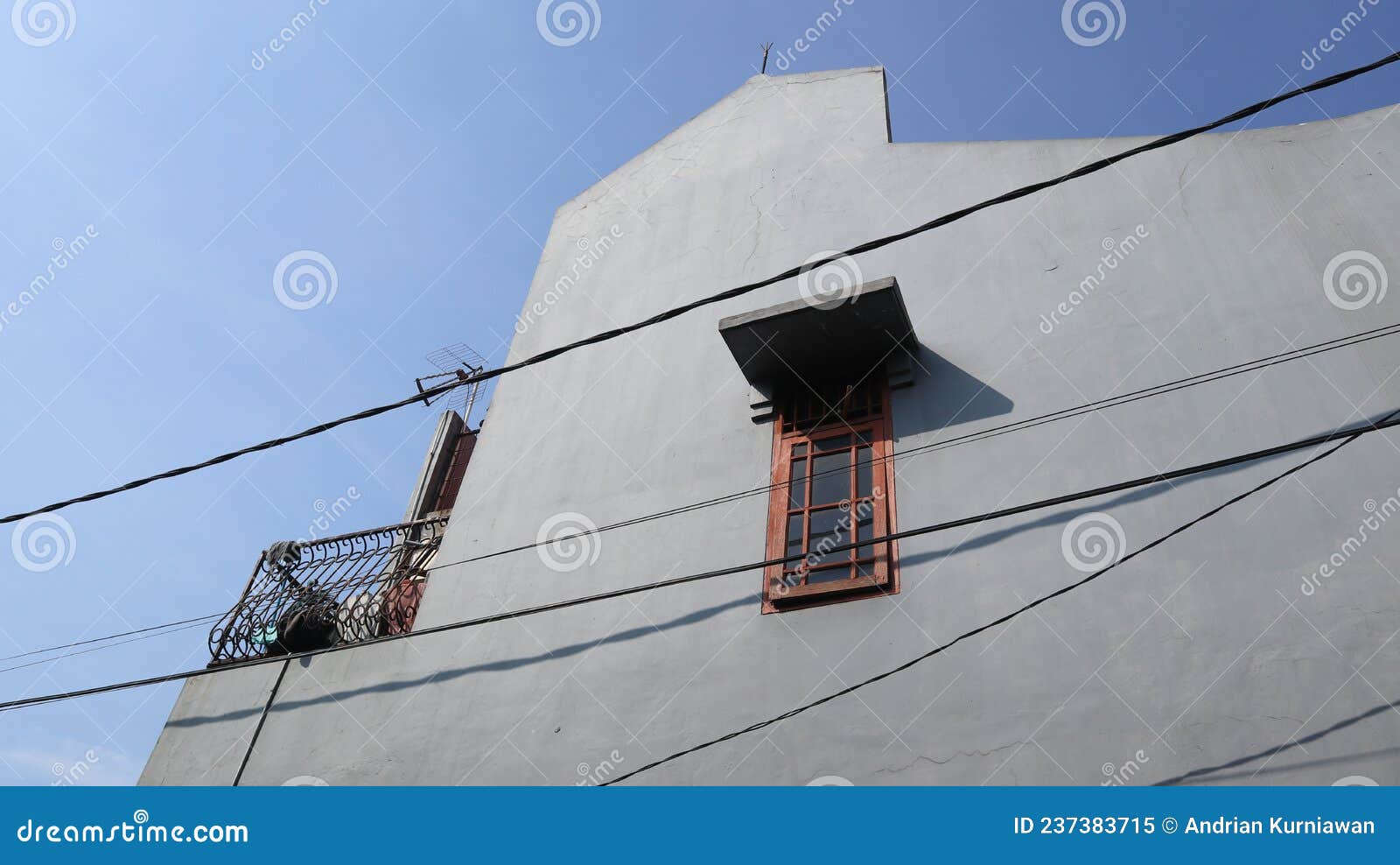 Bottom View of Building Wall with Clean Blue Sky Background Stock Image ...