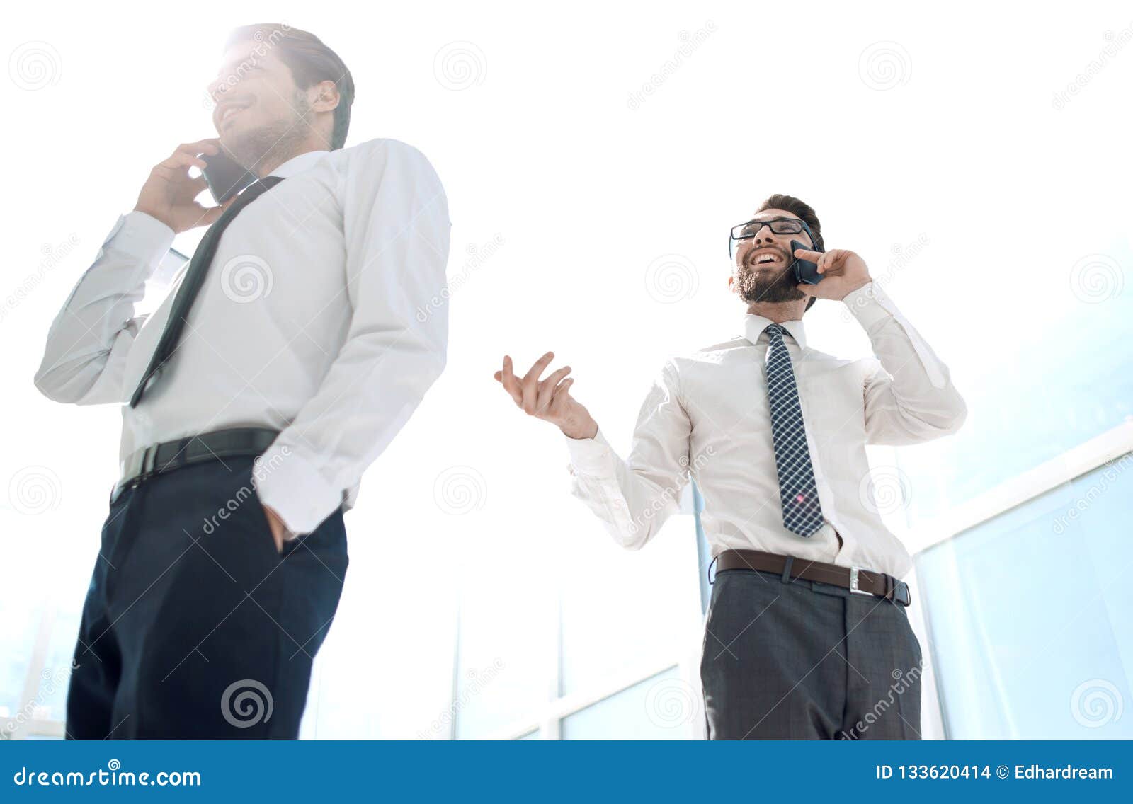 Bottom View.business People Talking on Their Mobile Phone in the Office ...