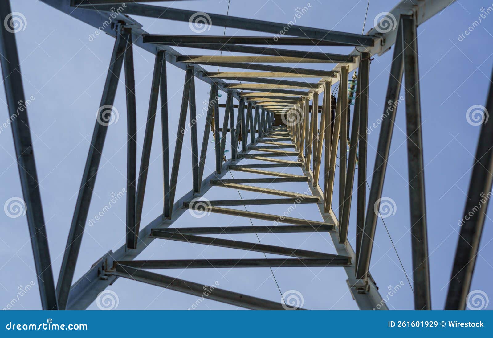Bottom View of an Electrical Tower Structure with a Blue Sky in the ...