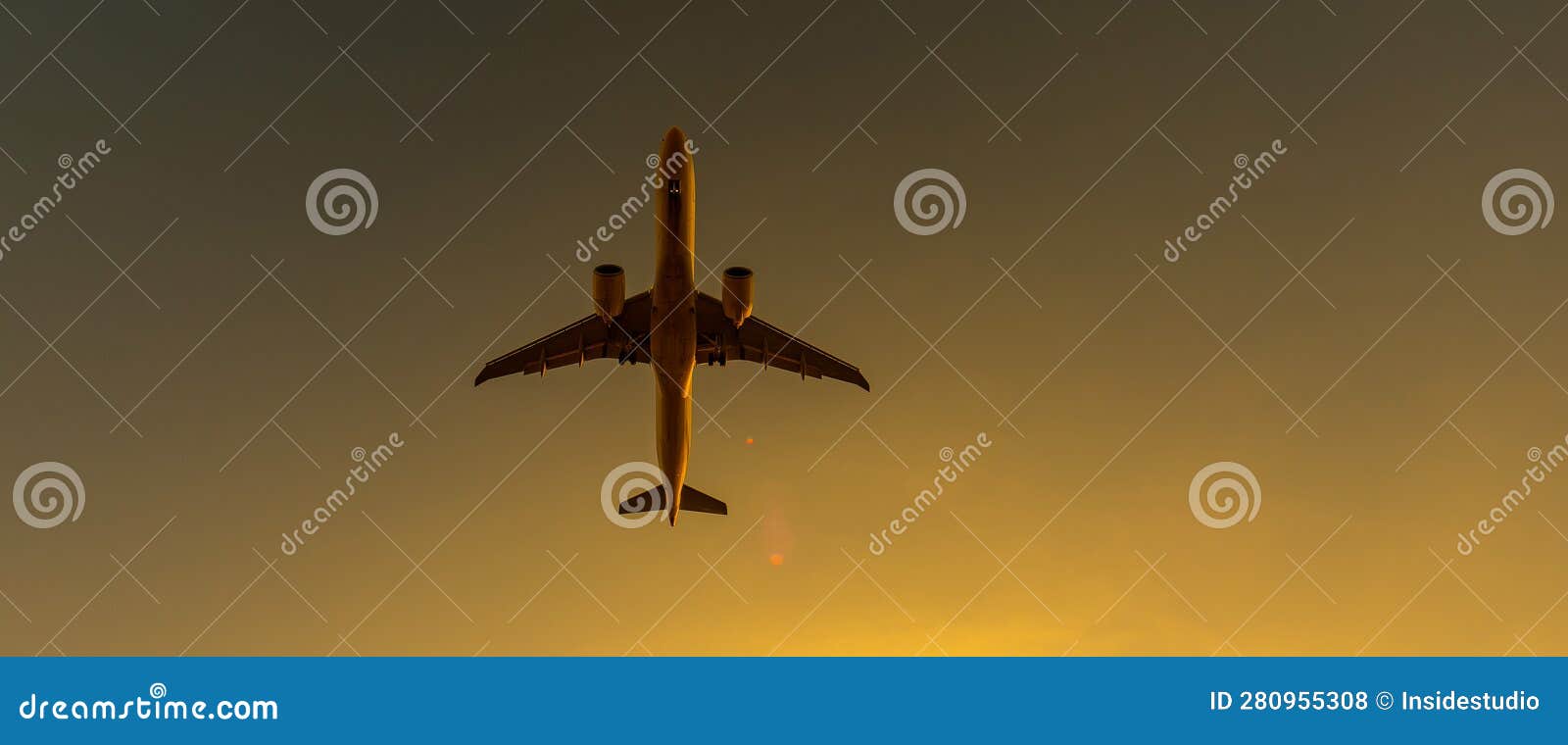 Bottom View of a Flying Plane at Sunset. Widescreen. Stock Photo ...