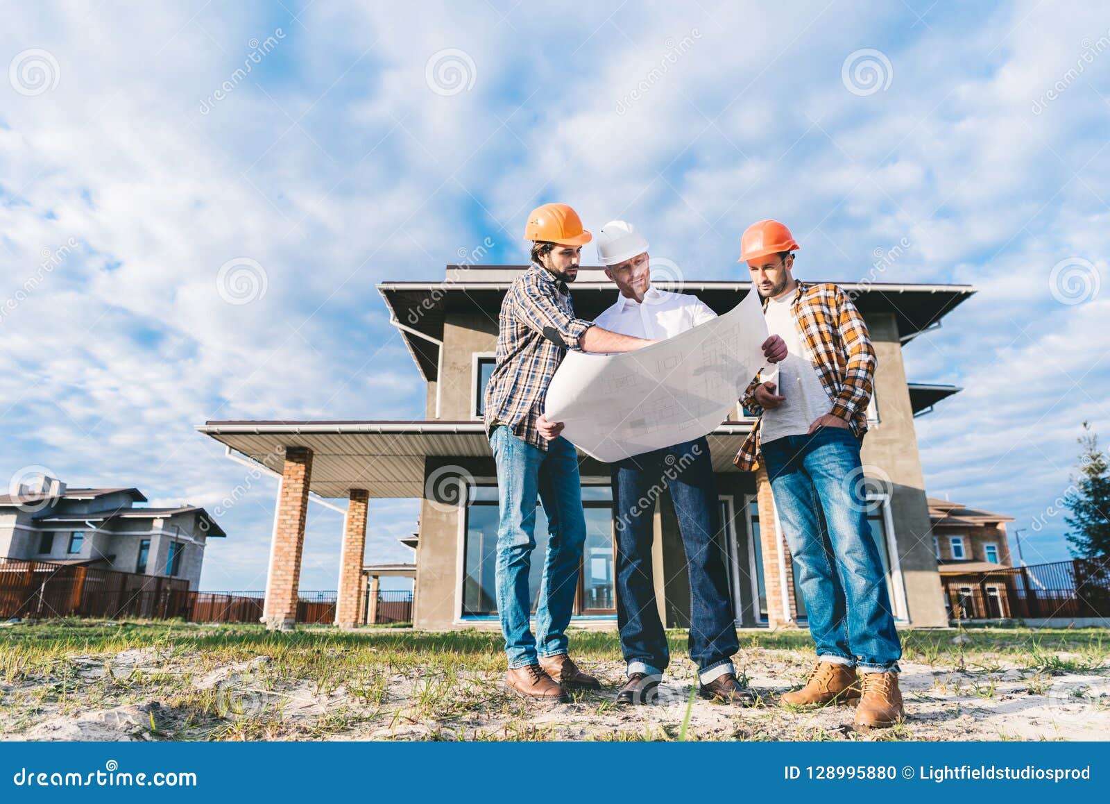 Bottom View Of Group Of Architects With Blueprint In Garden Stock ...