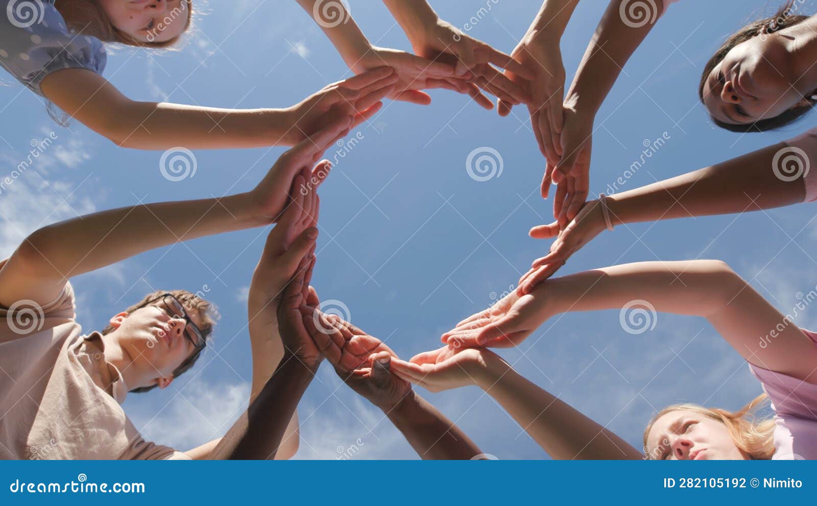 Bottom View of Group of High School Students Raise the Shape of a ...
