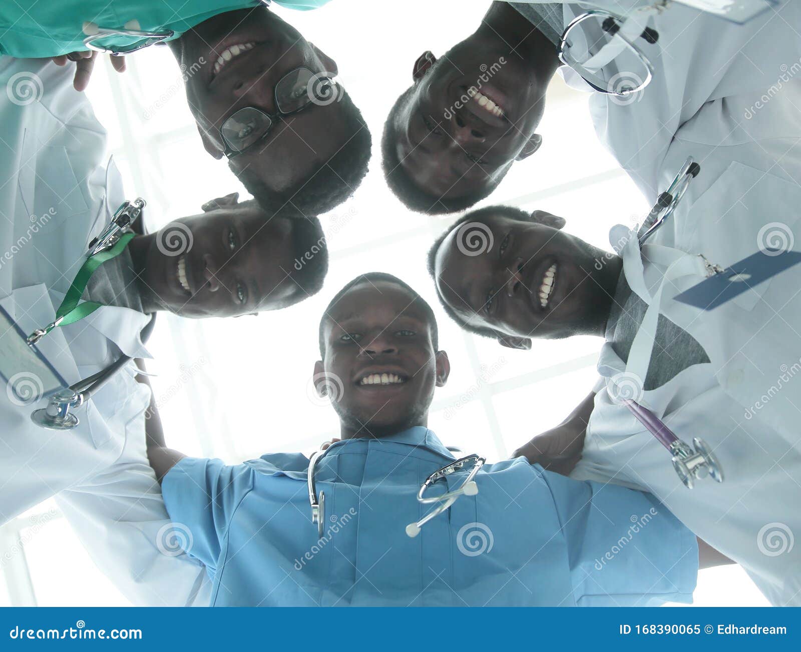 Bottom View. Group of Young Doctors Standing in a Circle Stock Image ... Bottom View. Group of Young Doctors Standing in a Circle Stock Image ...