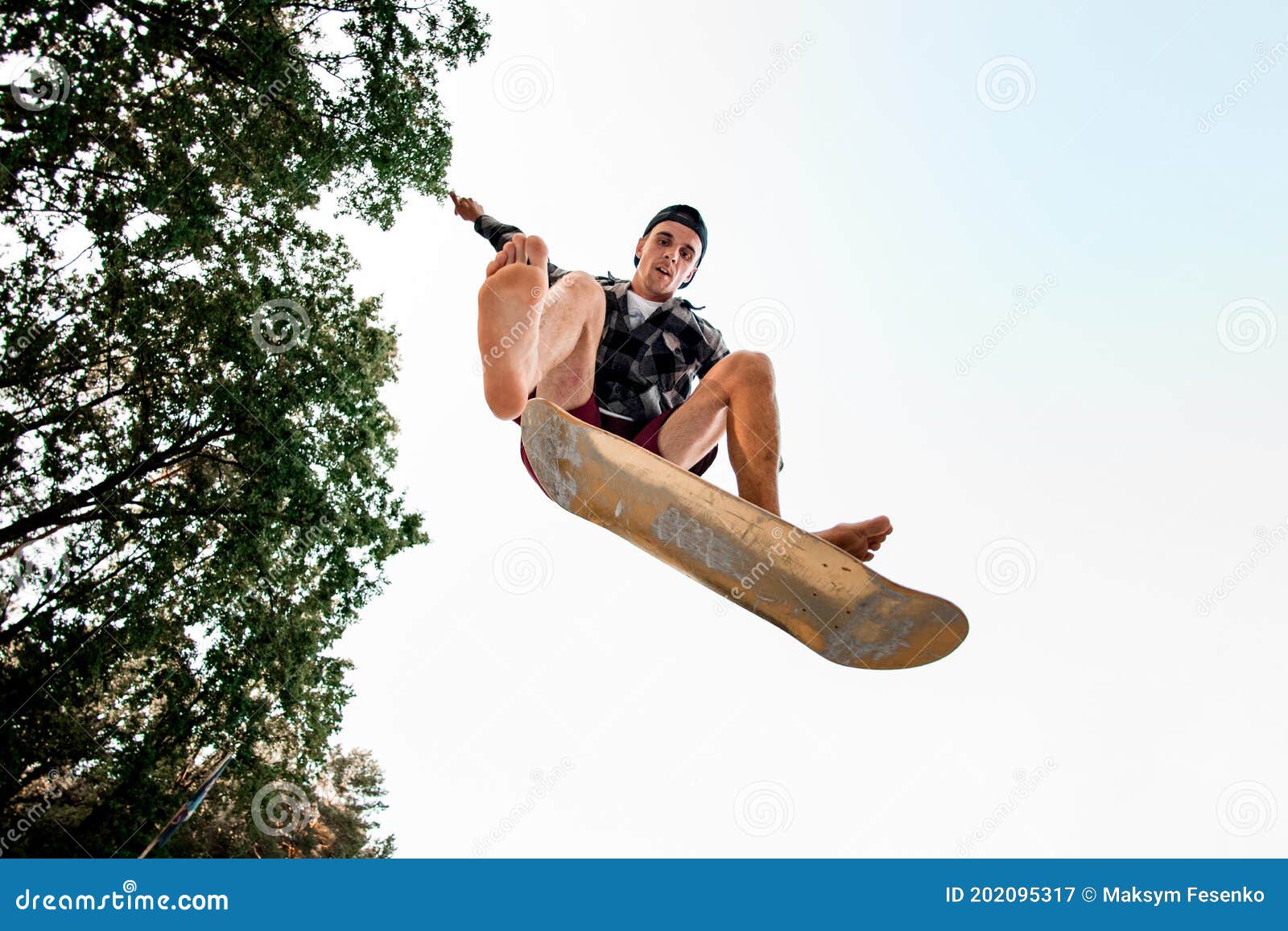 Bottom View of Guy with Skate Simulator Board Jumping Up Stock Image ...