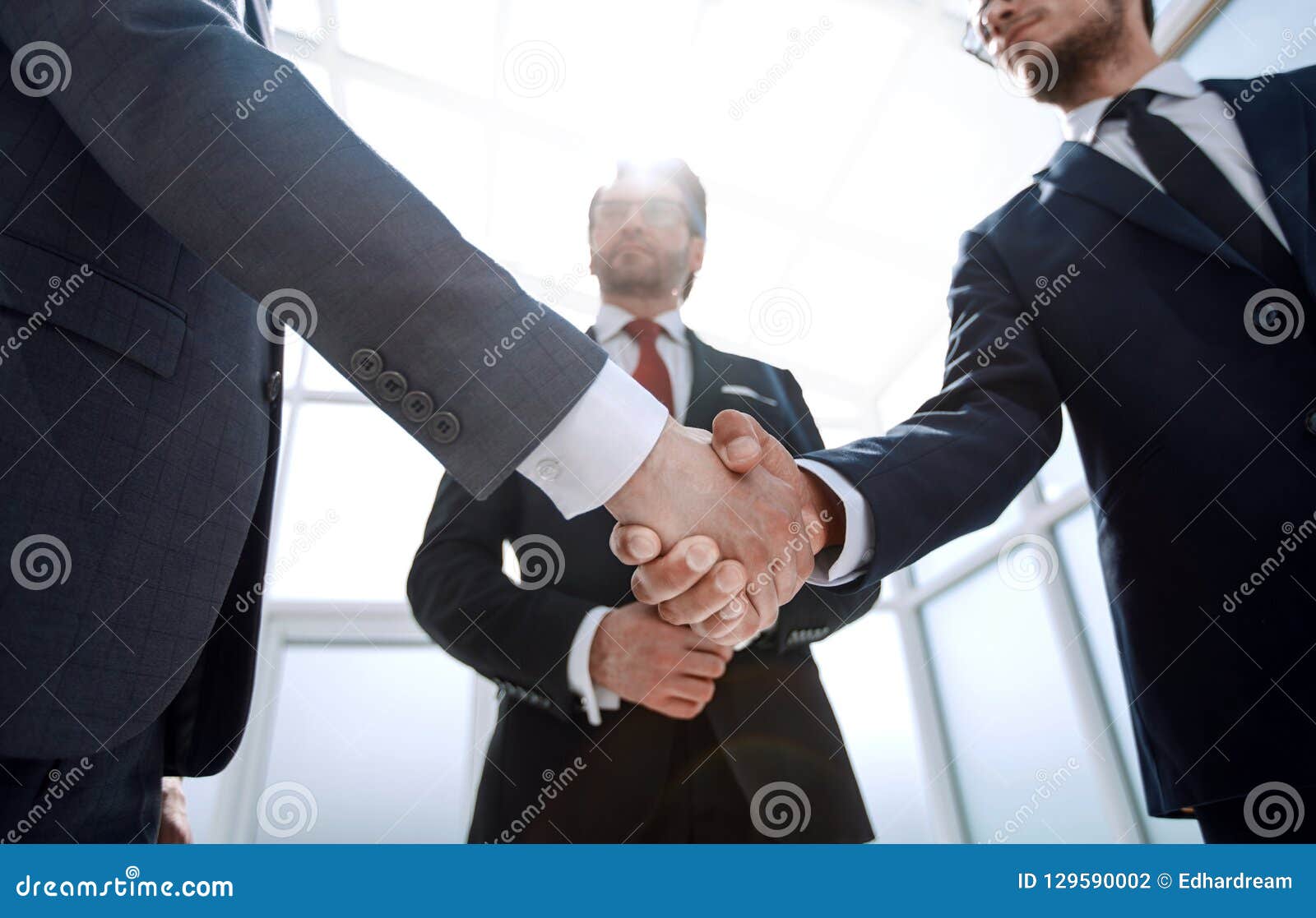 Bottom view.handshake stock photo. Image of employment - 129590002