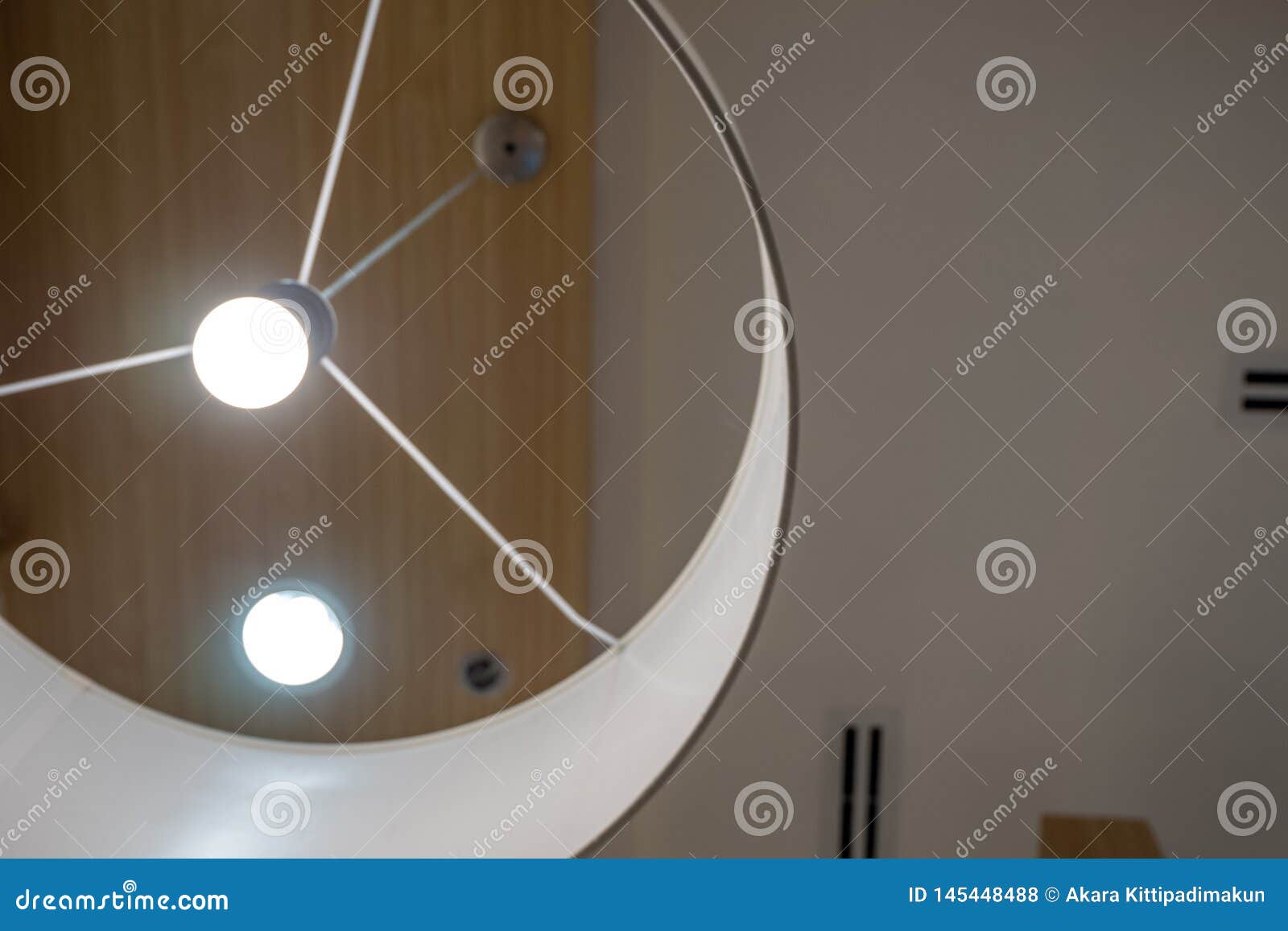 Bottom View of Light Bulb in Lamp Hanging from Ceiling on Blurred ...