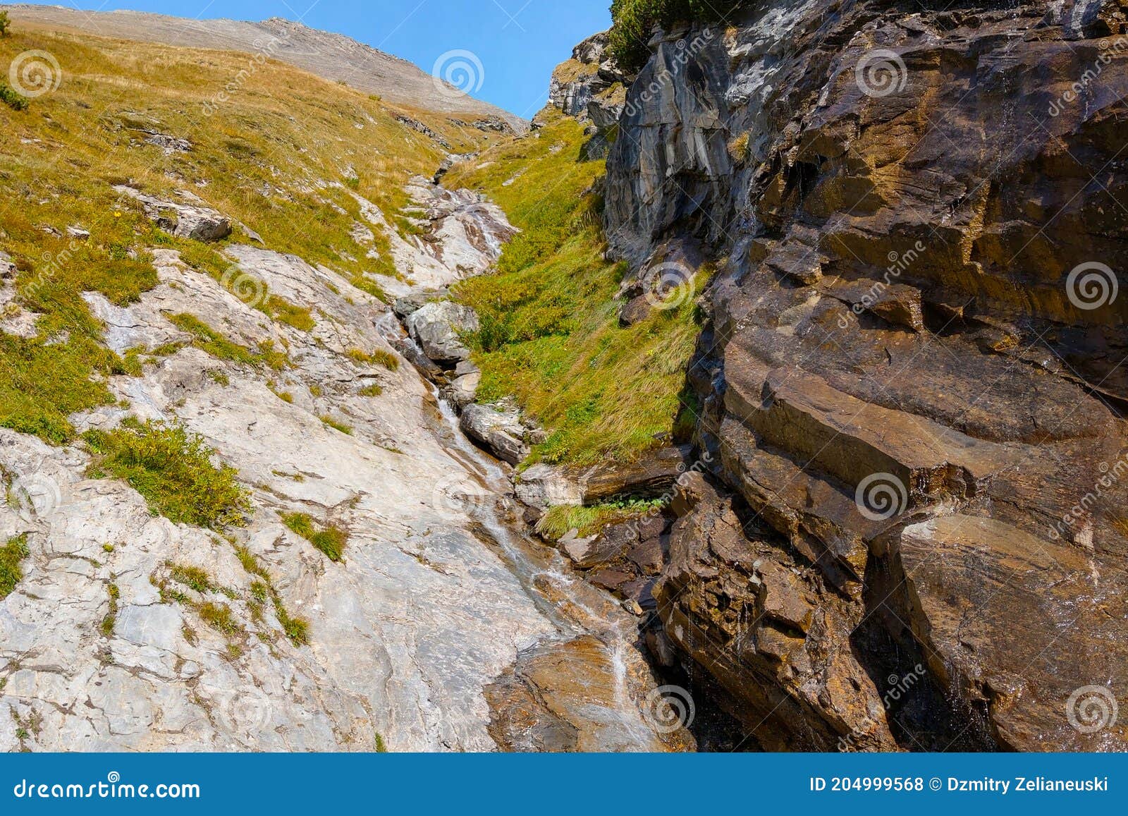 Bottom View of the Rocky Area. Water Flows Down the Slope Stock Photo ...