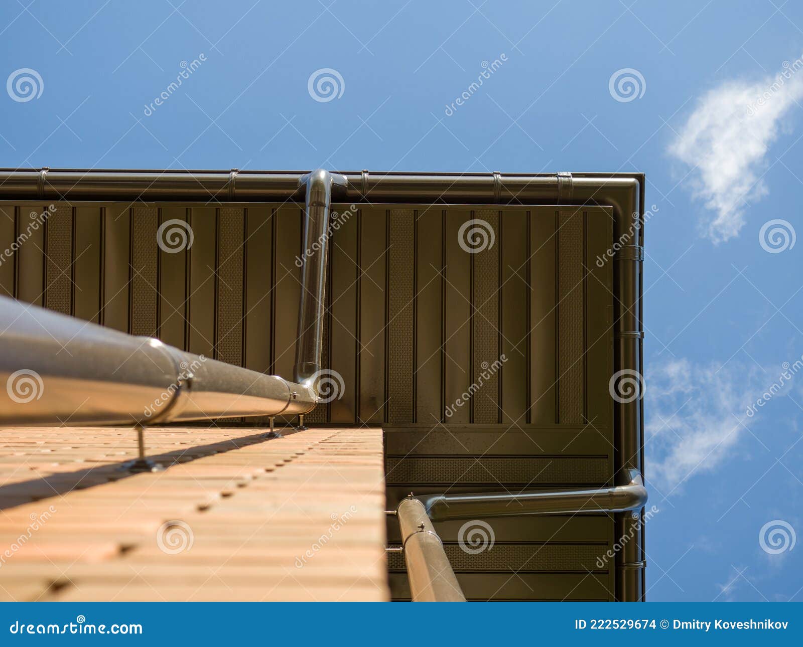 Bottom View of the Roof of a House with a Storm Drain and the Blue Sky ...