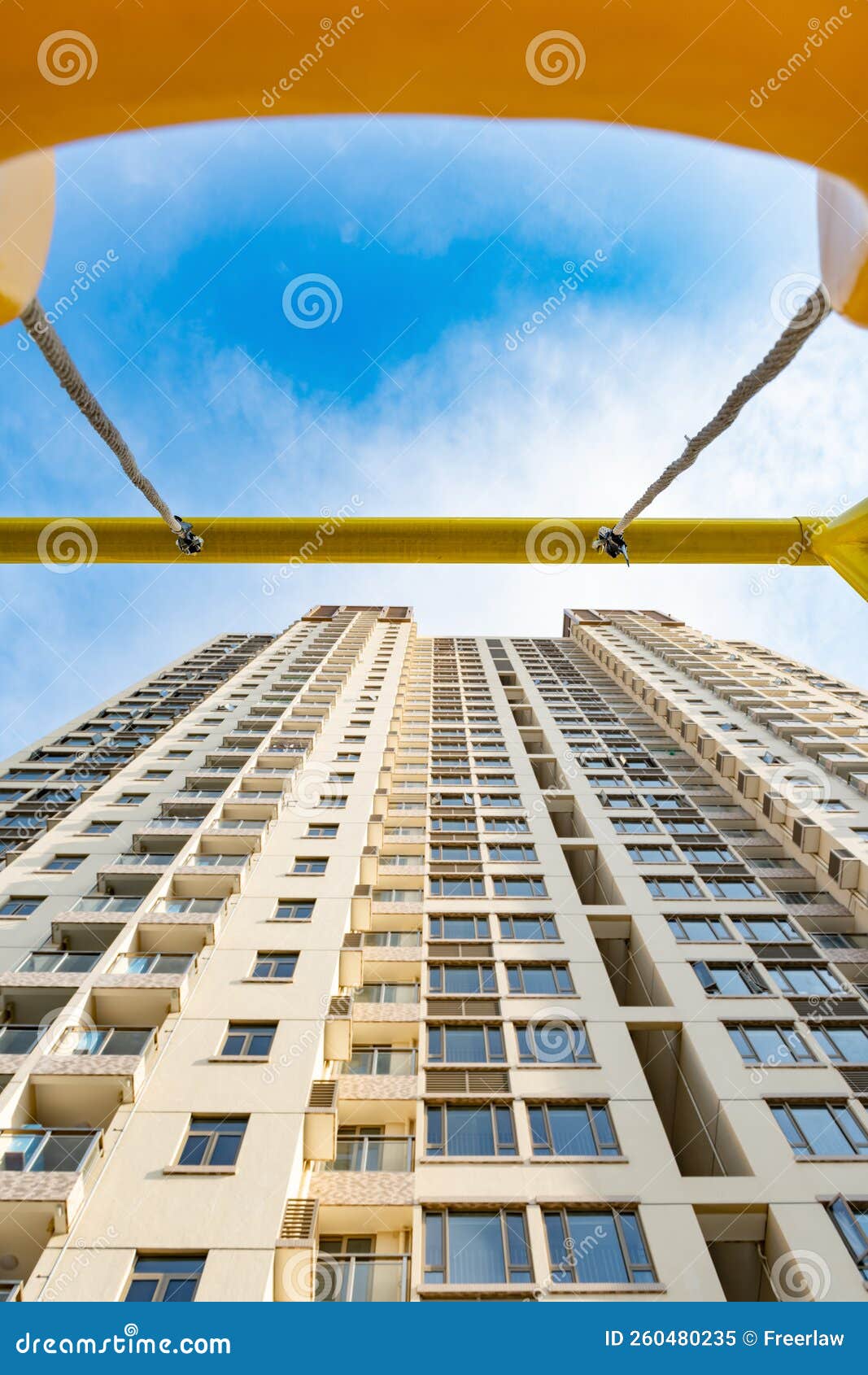 Bottom View of Swing Nearby a Residential Building Vertical Composition ...