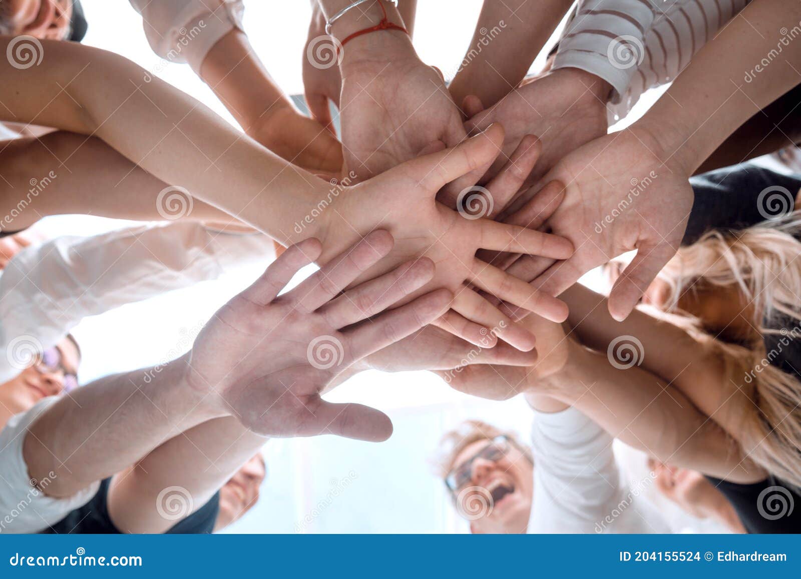 Bottom View . a Team of Young People Making a Tower Out of Their Hands ...