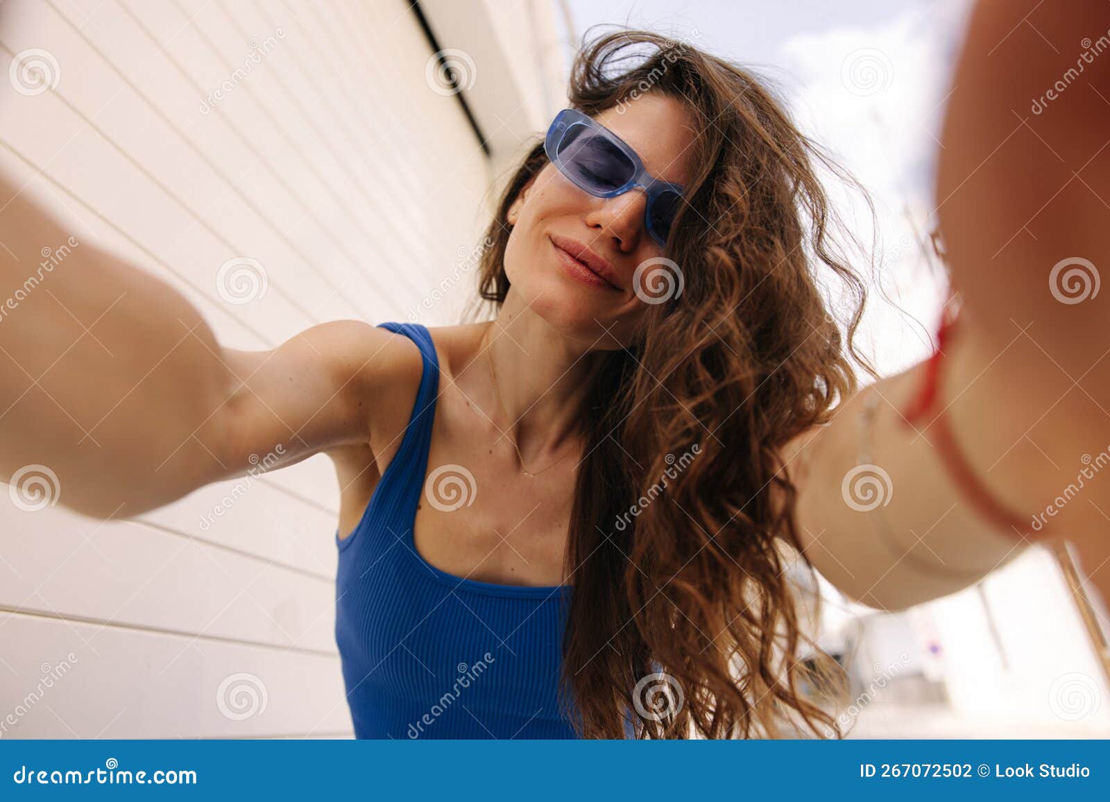 Bottom View Of Young Caucasian Woman With Closed Eyes Stretches Hands