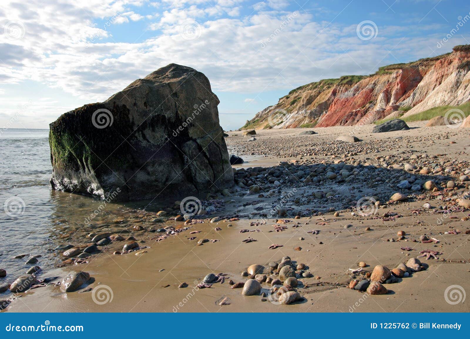 Boulder on the Beach stock photo. Image of cloud, clouds - 1225762
